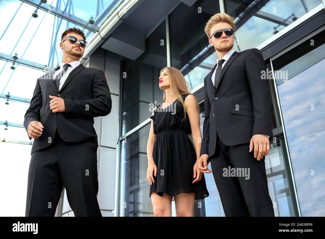 Famous celebrity with bodyguards outdoors Stock Photo - Alamy