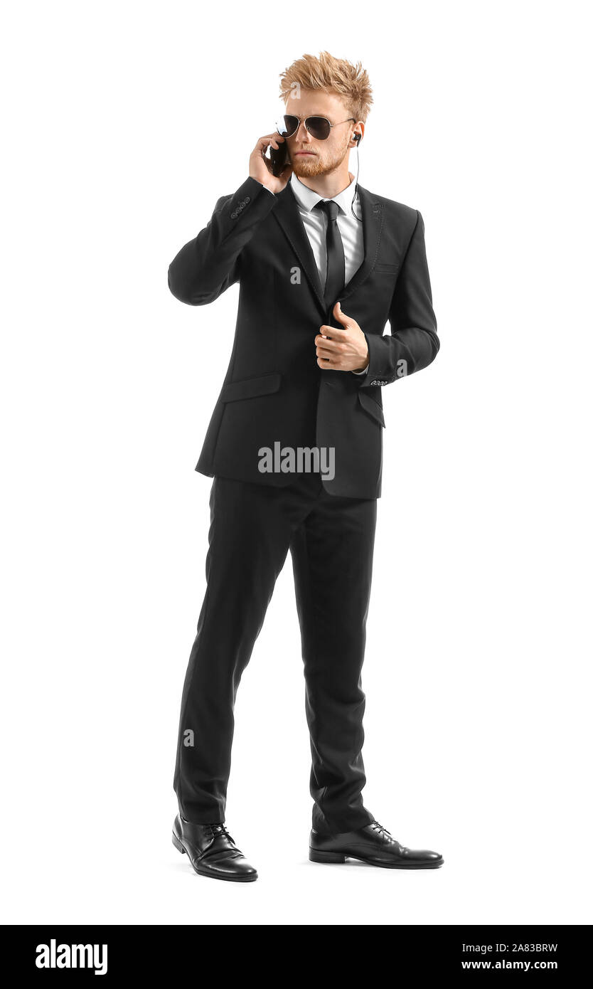 Handsome security guard talking by phone on white background Stock ...