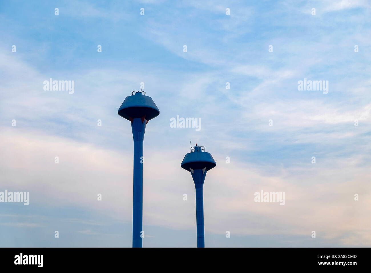High blue tower and background blue sky Stock Photo - Alamy