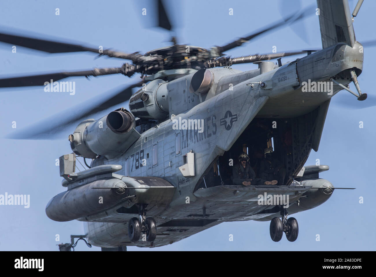 A U.S. Marine CH-53E Super Stallion helicopter carries Marines with ...