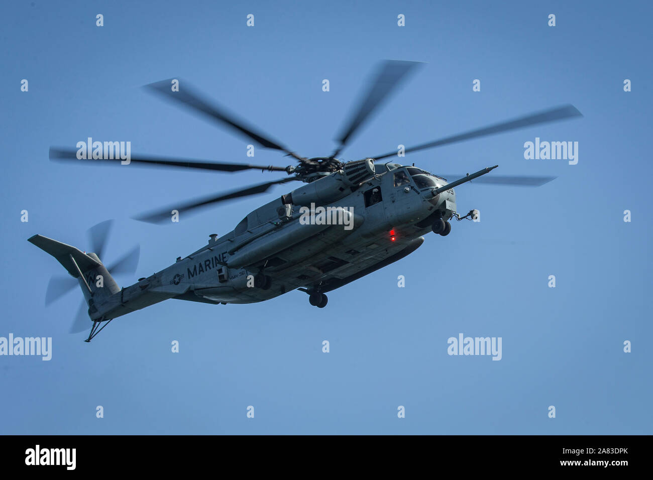 A U.S. Marine CH-53E Super Stallion helicopter carries Marines with ...
