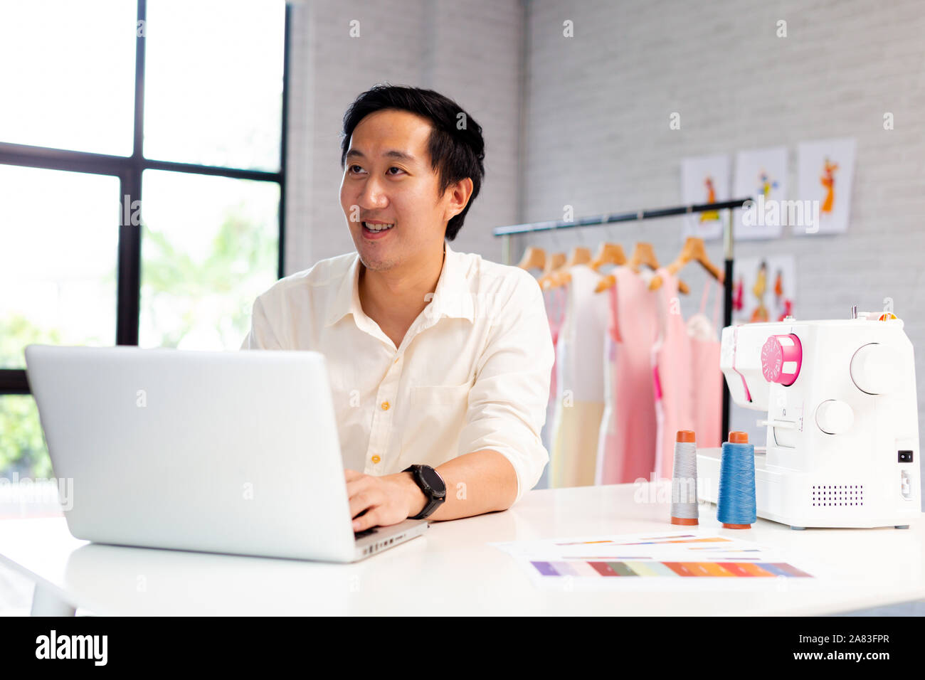 Contemporary confident Asian male entrepreneur and fashion designer in ...