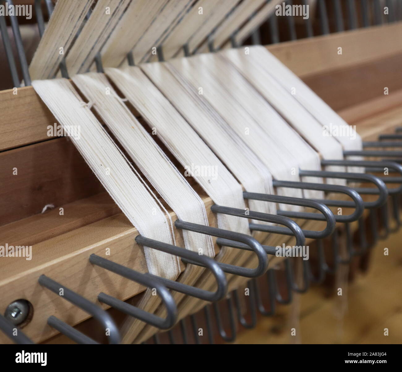 sectional warp beam with white cotton undyed warp Stock Photo - Alamy