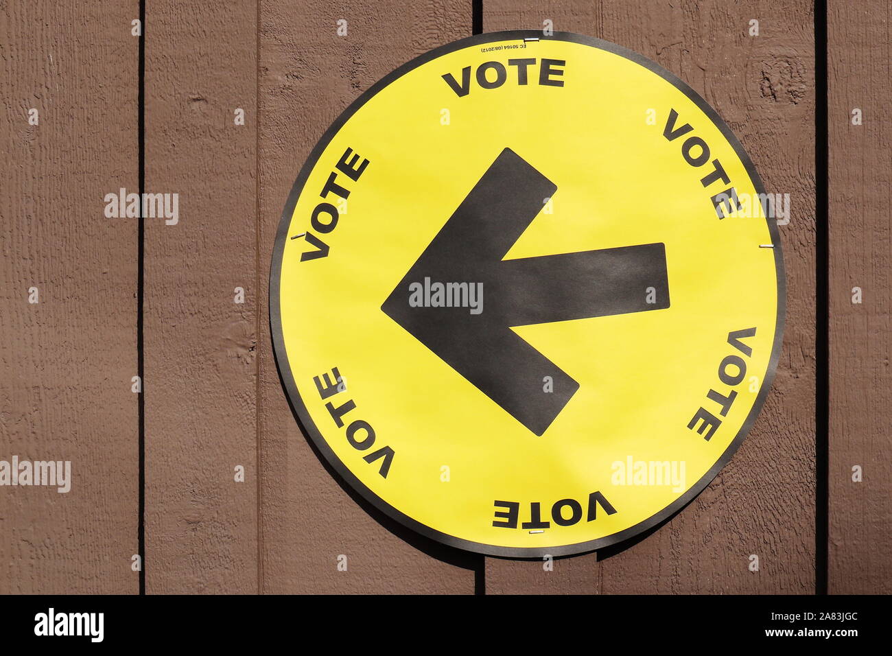 Canadian circular vote sign pointing left Stock Photo - Alamy