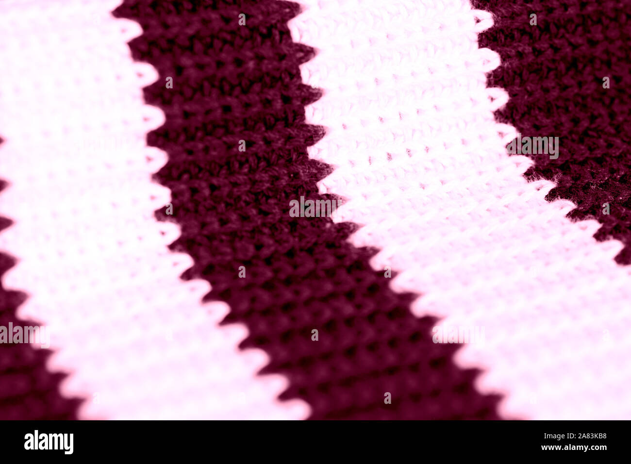 Striped knitwear texture close up. Textile background pink color toned ...