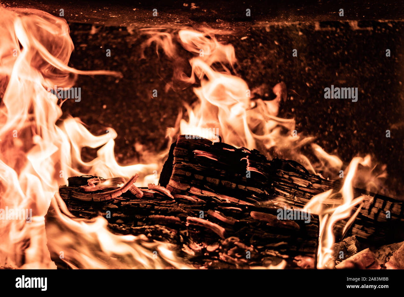 Wood logs burning with flames close up still Stock Photo - Alamy