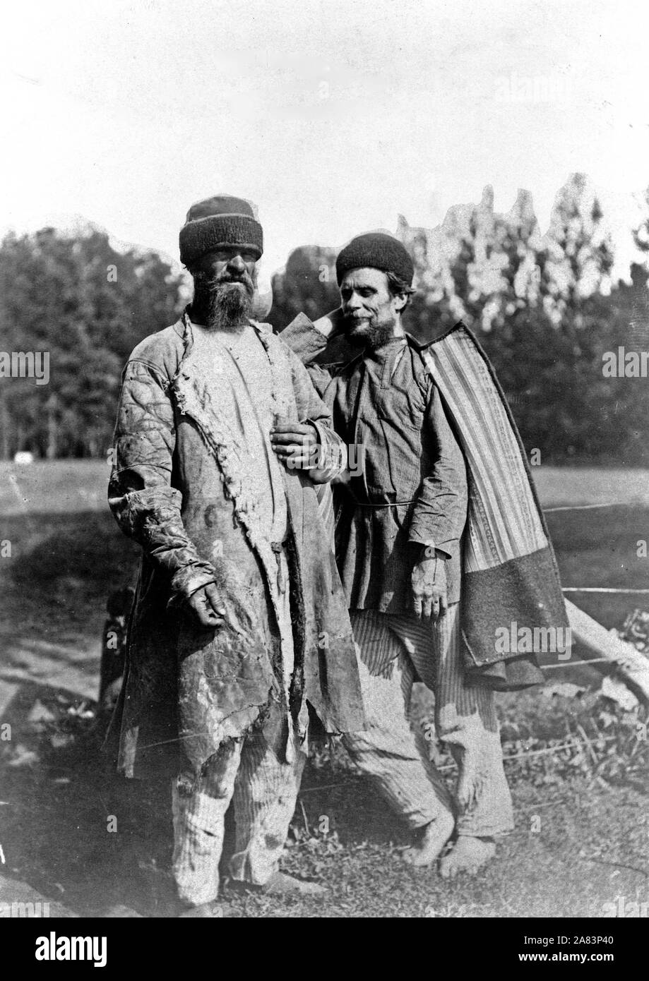 Two men standing, outdoors, full-length, Russia 1880-1924 Stock Photo ...