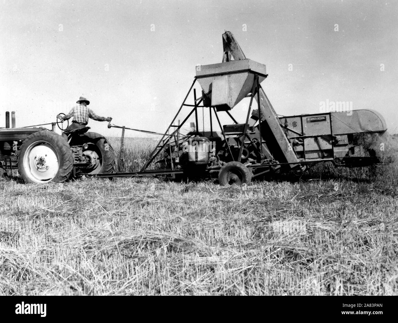 Man Working with Farm Equipment 1934-1946 Stock Photo - Alamy