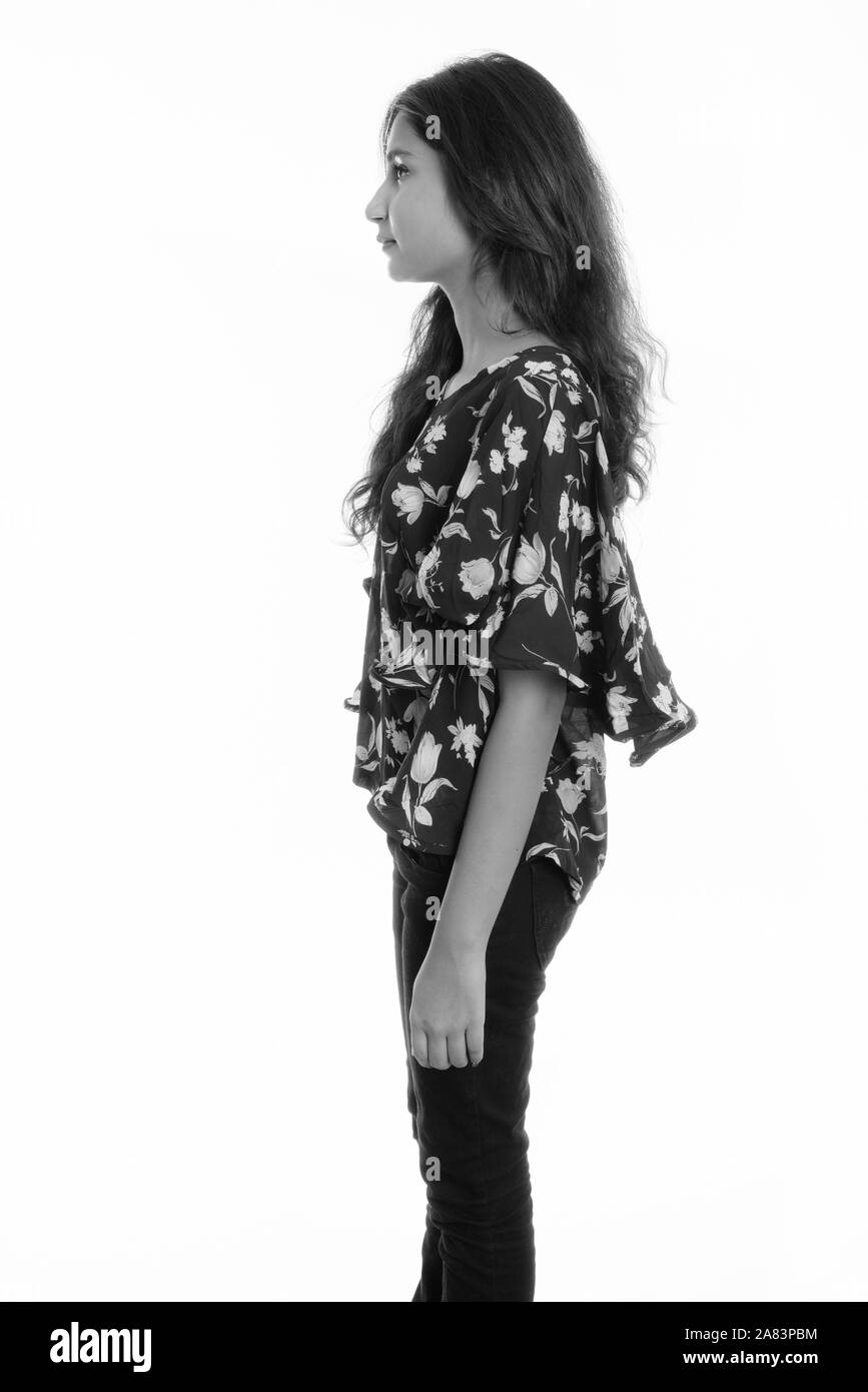 Profile view of young beautiful Persian woman standing Stock Photo - Alamy