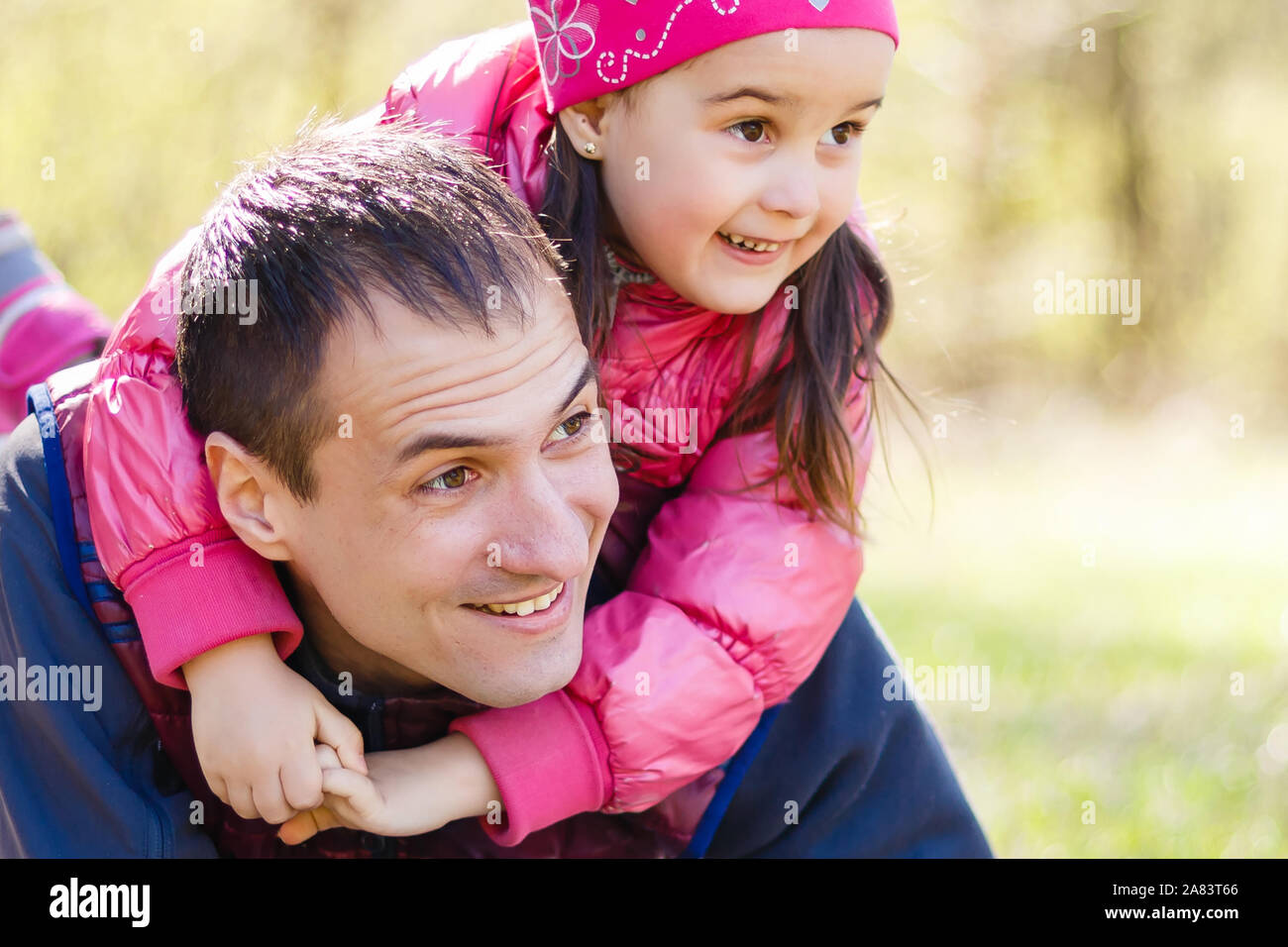 Devoted father and daughter lying sunny day. lifestyle, childhood and ...
