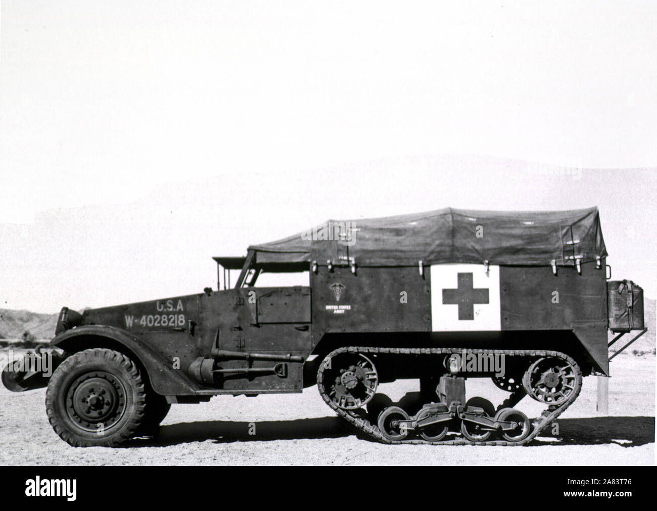 Side view of M-3 half-track which has been converted into an ambulance ...