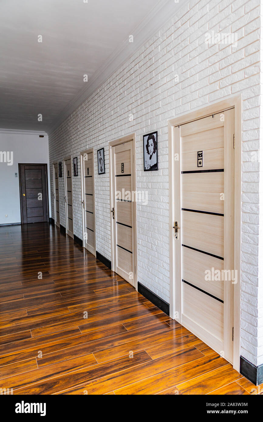 Hostel Corridor Room Doors with Artistic Retro Paintings and Wooden ...