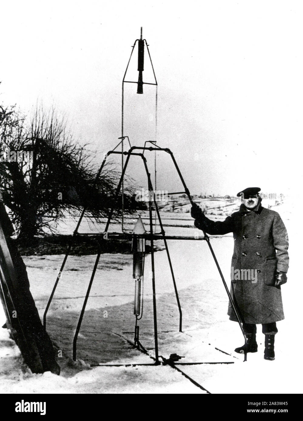 Dr. Robert H. Goddard and a liquid oxygen-gasoline rocket in the frame ...