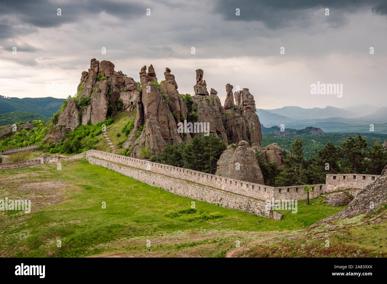 Amazing rock formations and walls of a medieval fortress in ...
