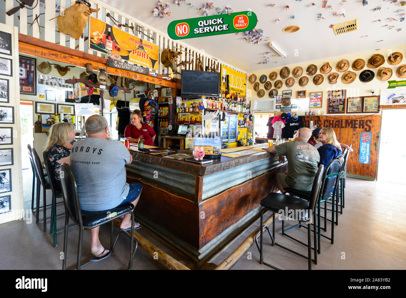 Clients drinking at the bar of the iconic bush pub Nindigully Pub ...