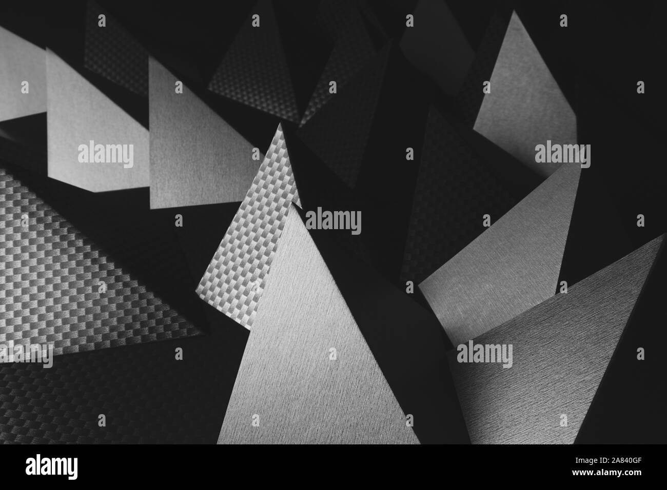 Triangular shapes of paper on dark background, abstract Stock Photo - Alamy