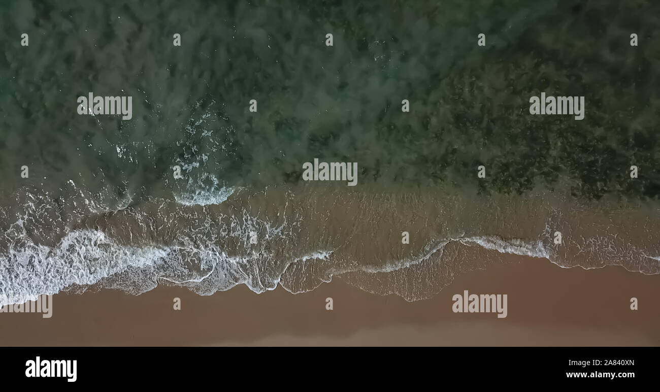 Aerial view, shot with drone on the coast of Angola, water with waves on the beach Stock Photo ...