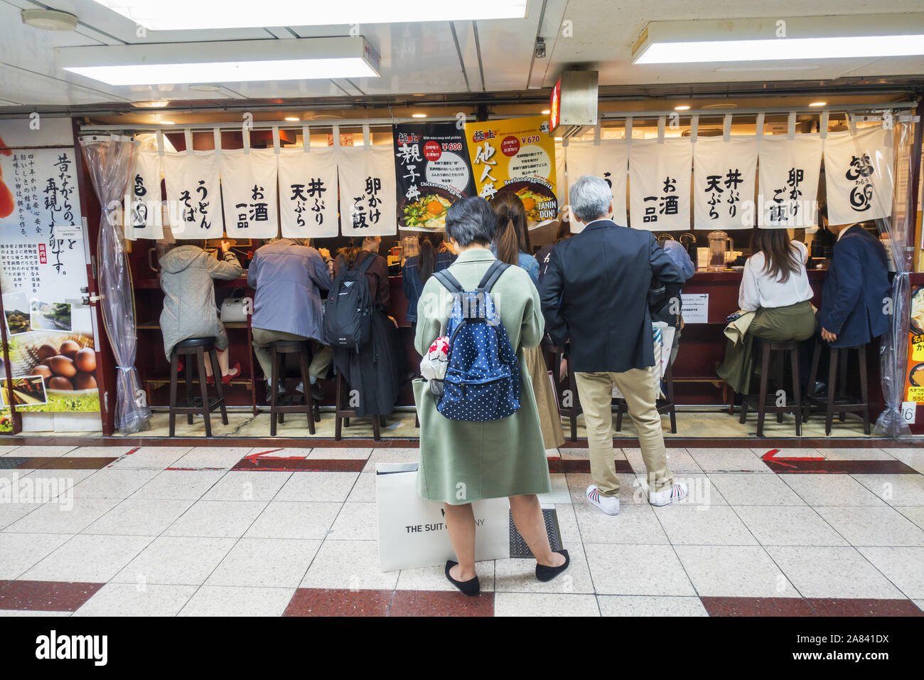 Osaka, Japan - November 3rd, 2019: People eating in Izakaya, a type of ...