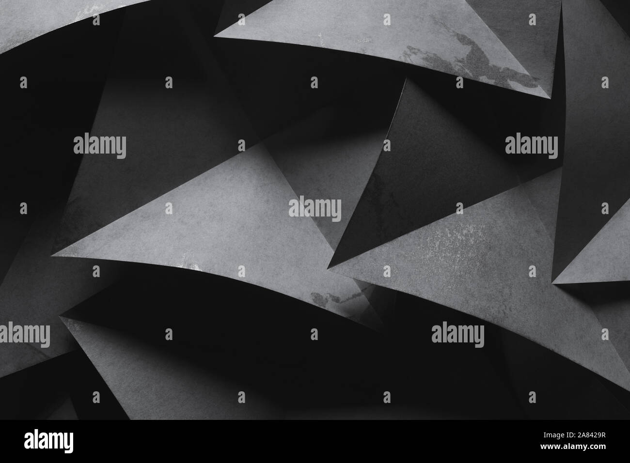 Geometric shapes of gray paper for dark background Stock Photo - Alamy