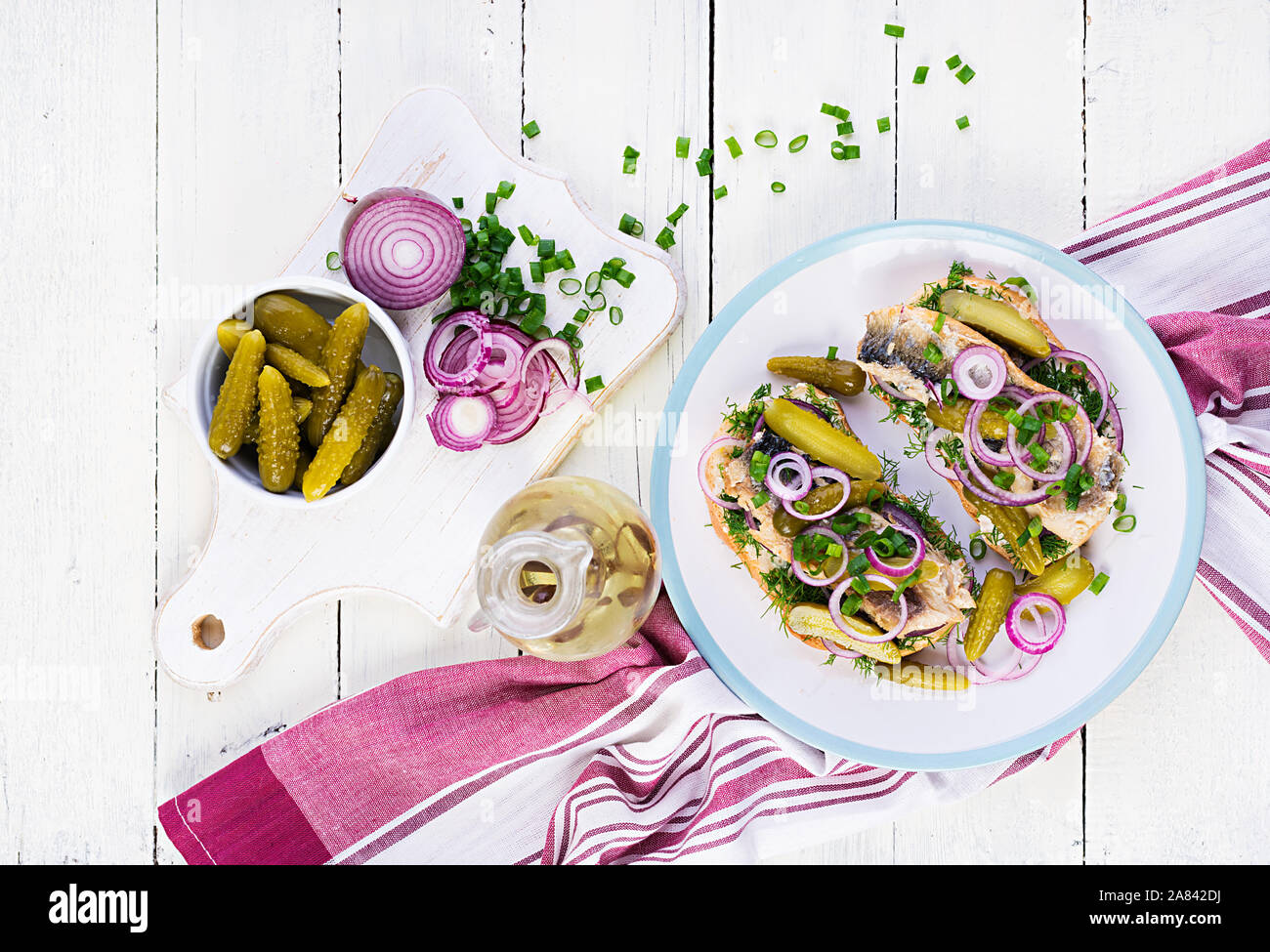 Traditional Dutch sandwich with herring and pickles cucumbers on white ...