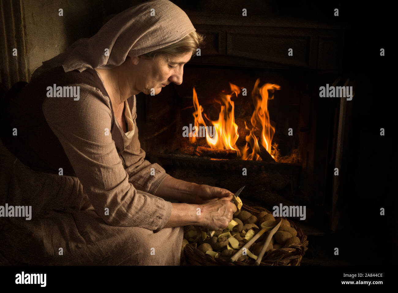 Renaissance old master portrait of a peasant woman peeling potatoes at ...