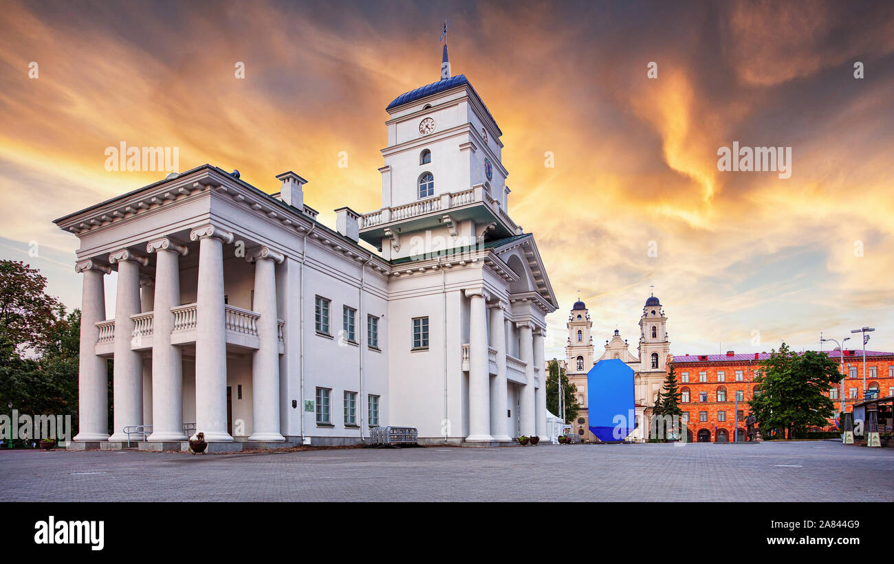 Minsk, Belarus. Old Minsk City Hall on Freedom Square Hall with rainbow ...