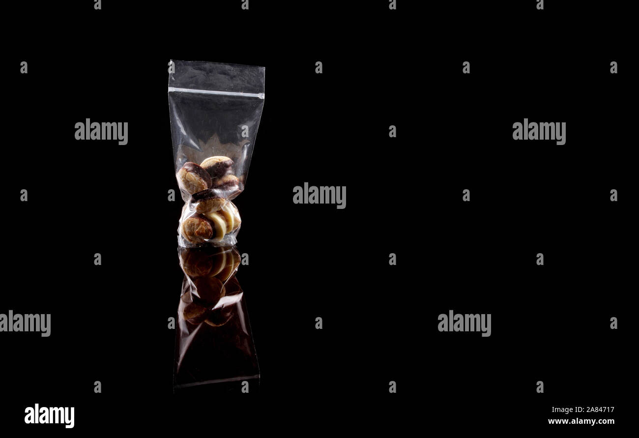 sweets in plastic food packaging with reflection and copy space Stock ...