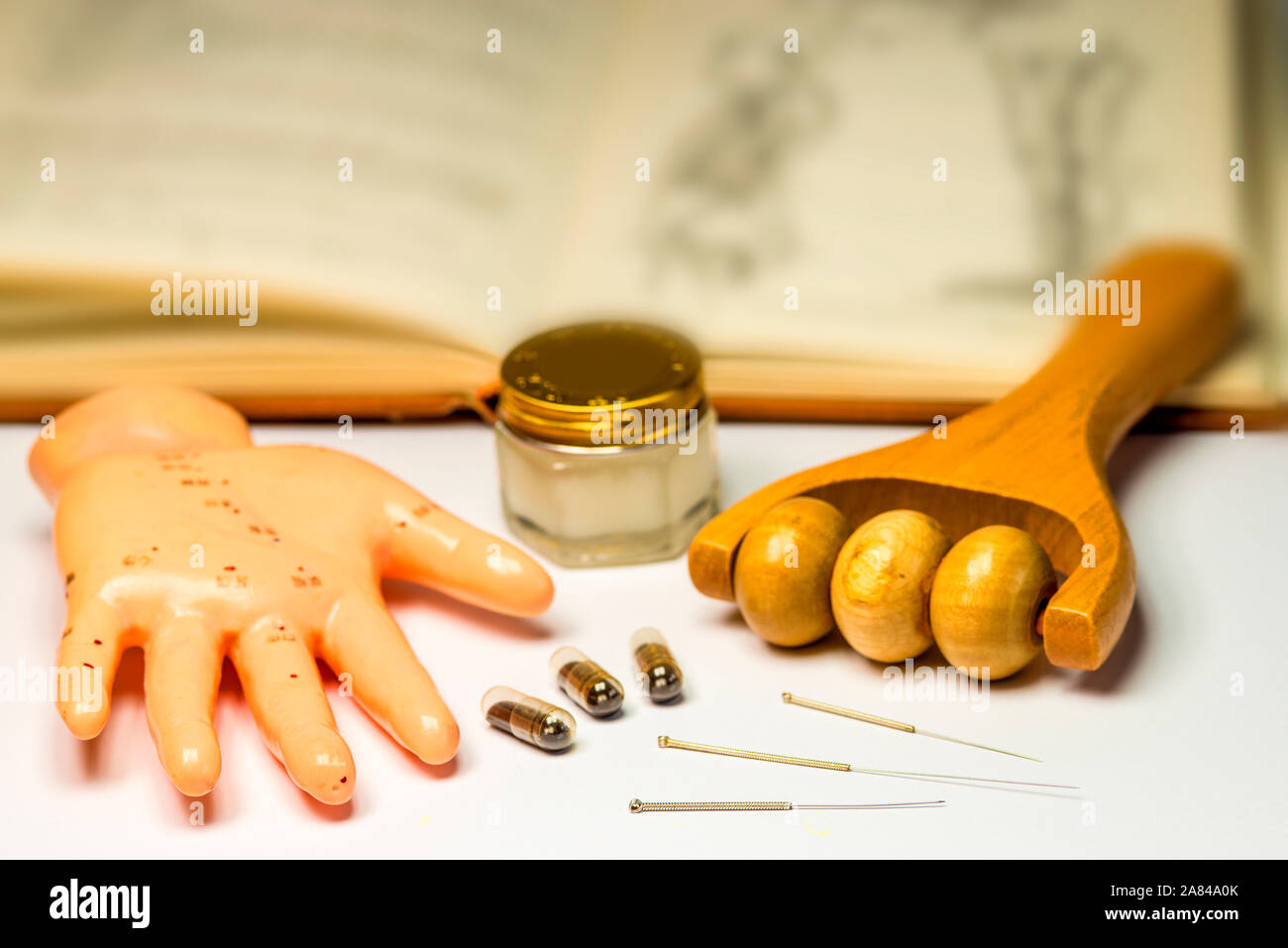 acupuncture needles with hand model, massage roller, pills, ointment ...