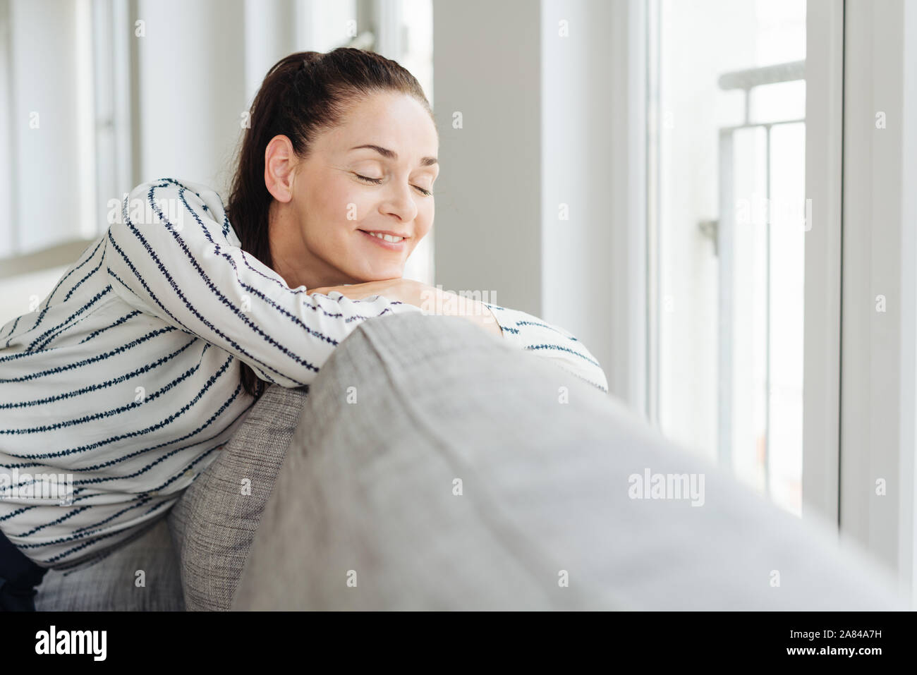 Resting arms on sofa hi-res stock photography and images - Alamy