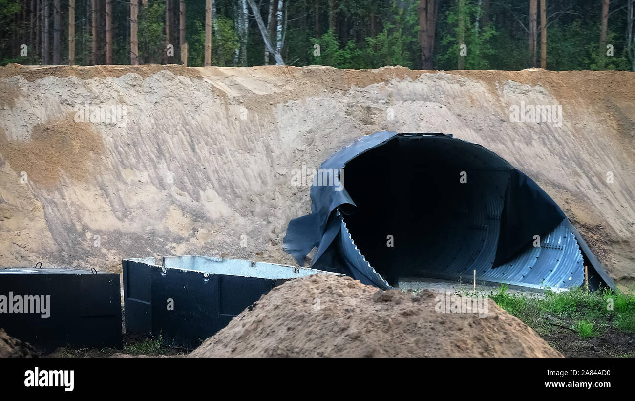 Construction of the highway. Laying culvert in sand bed Stock Photo - Alamy