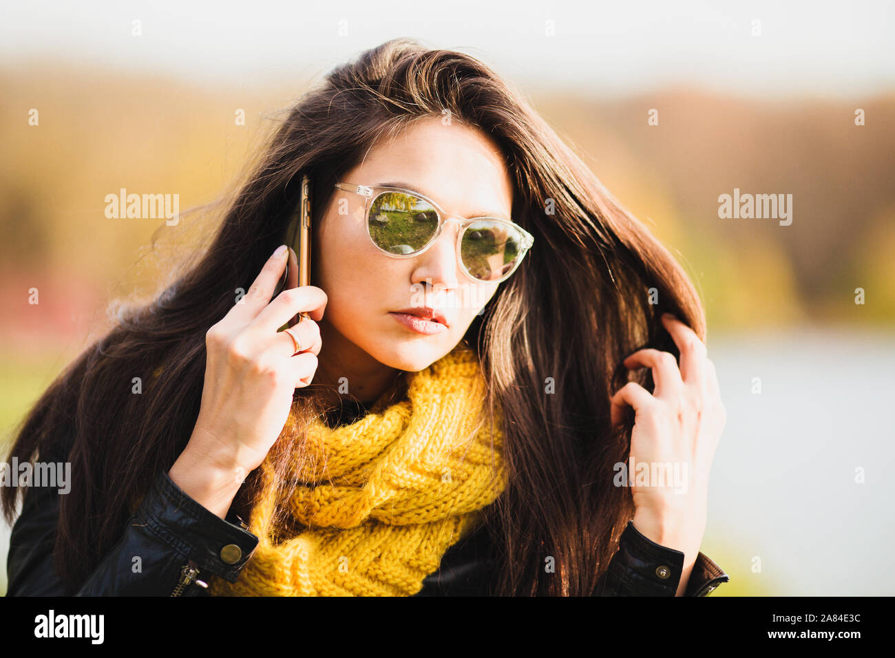 Pretty charming brunette with a bright appearance communicates on the ...