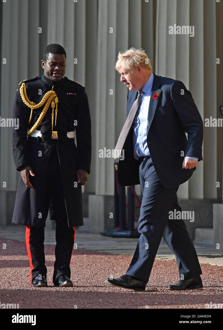 Prime Minister Boris Johnson passes The Queen's Equerry, Major Nana ...
