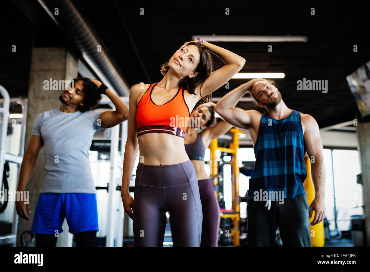 Beautiful fit people working out in gym together Stock Photo - Alamy