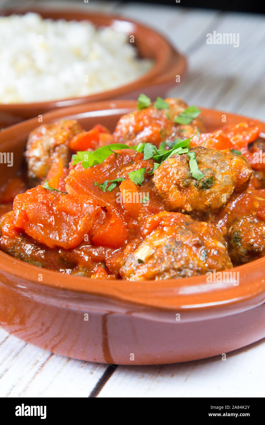 A traditional Turkish dish of baked meatballs in tomato and red pepper ...