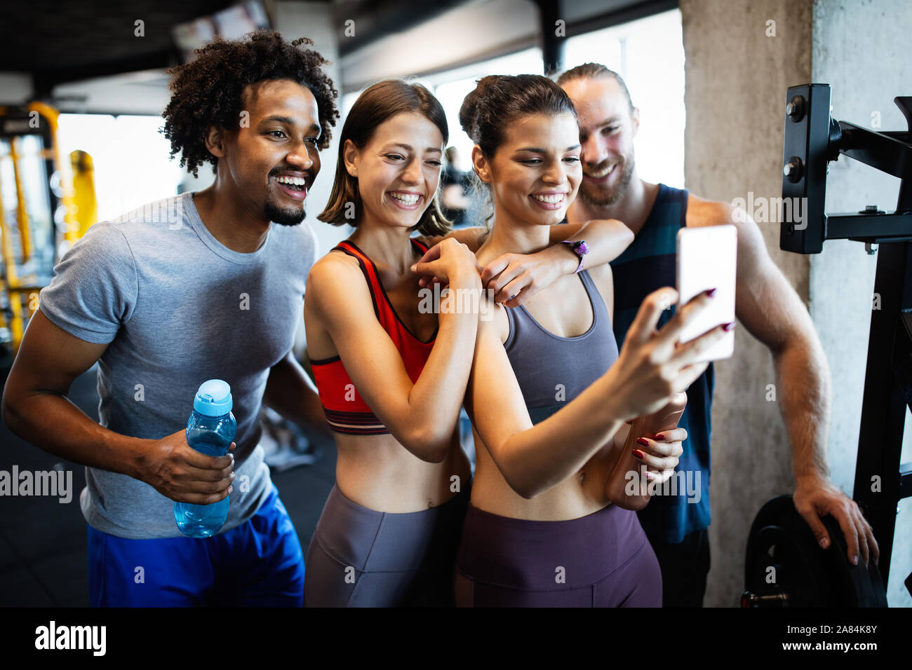 Group of friends having fun at the gym, making a selfie Stock Photo - Alamy