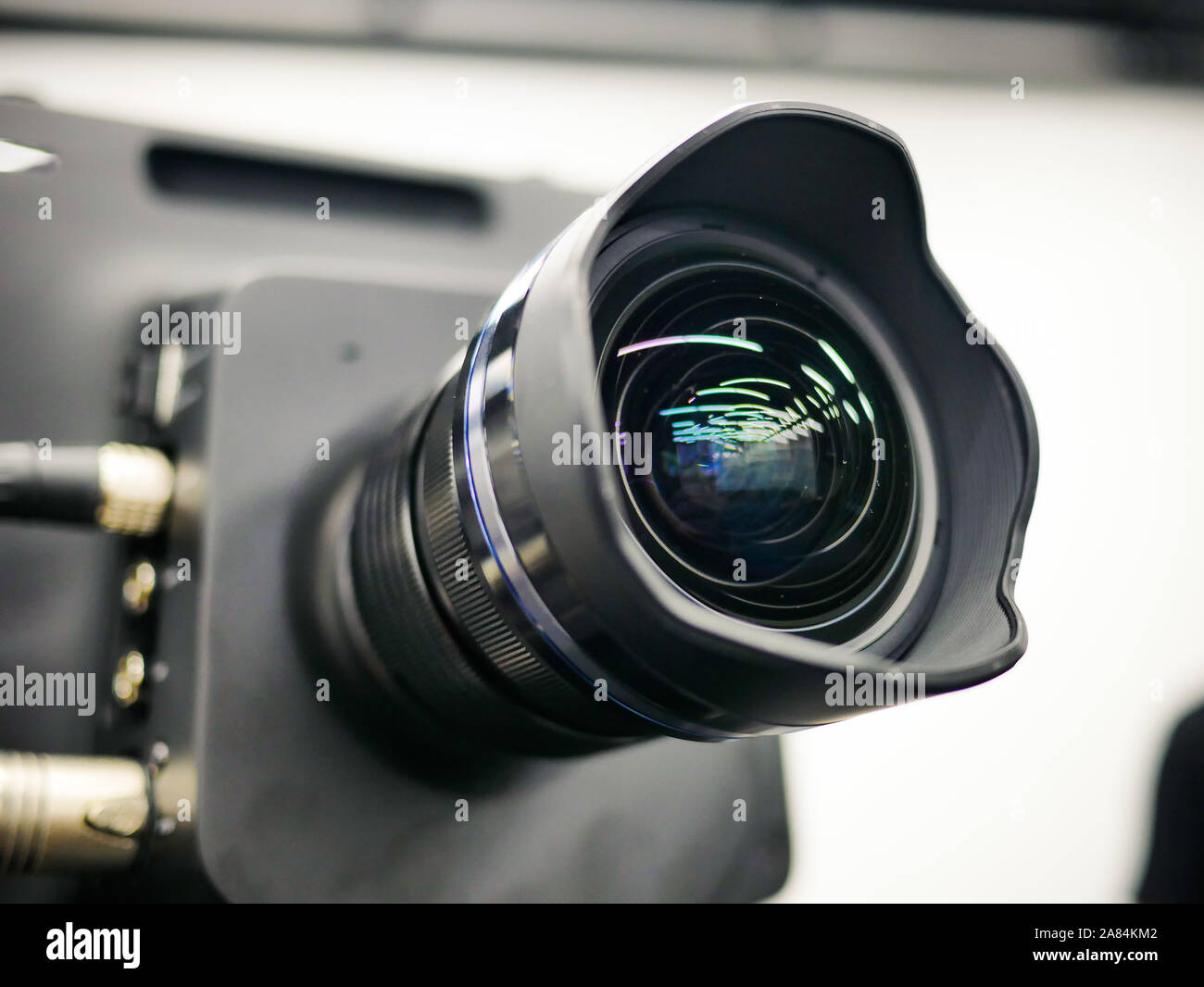 Close up shot of camera lens set up filming in the studio. Reflection ...