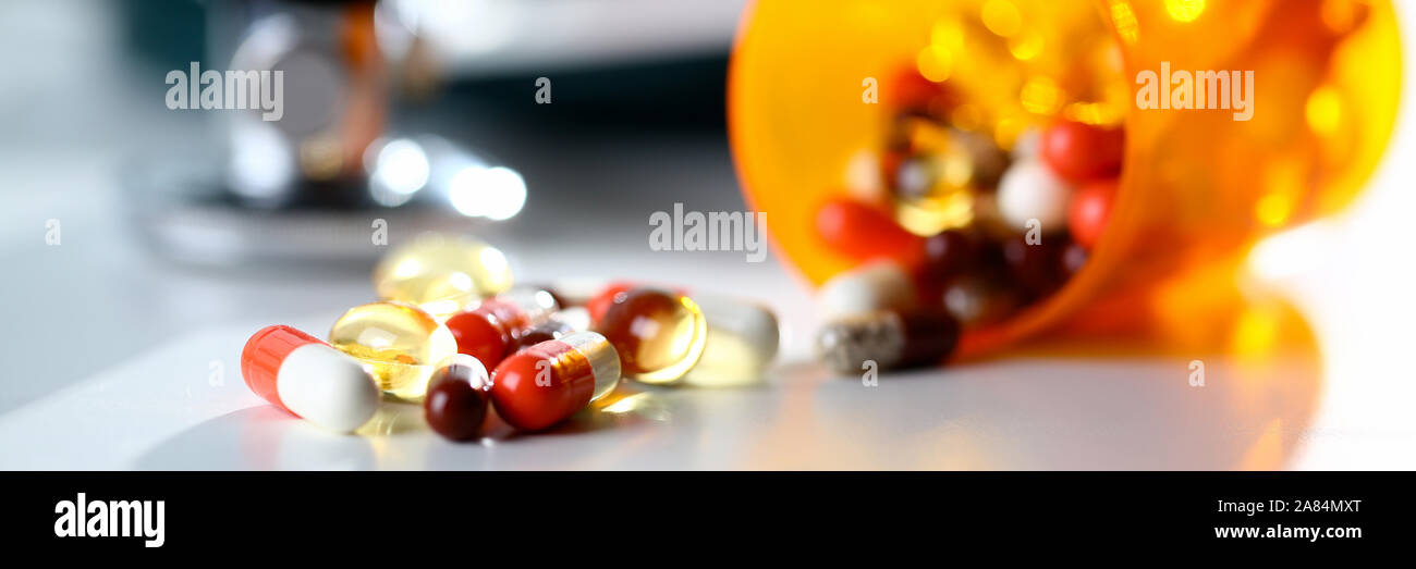 Tablets scattered on the table of the Stock Photo - Alamy