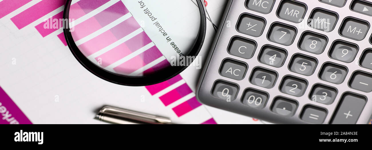 Silver calculator and financial statistics on clipboard Stock Photo - Alamy