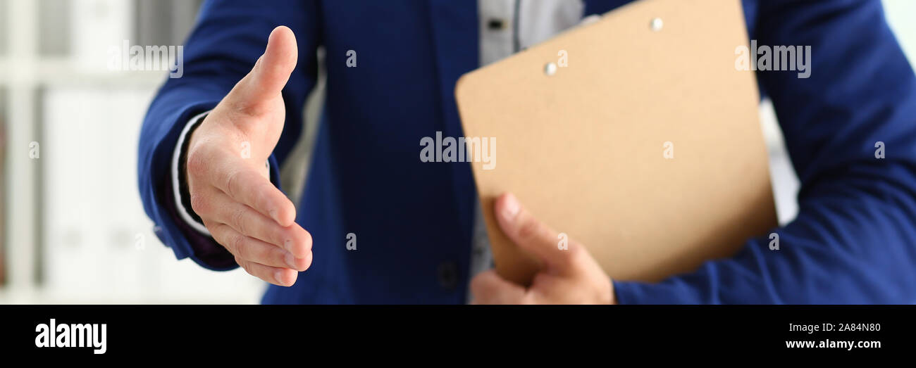 Man in suit and tie give hand as hello Stock Photo - Alamy