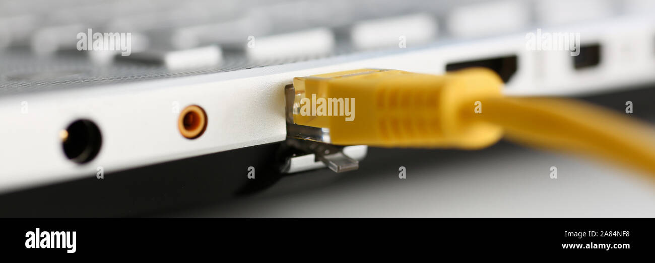 The network connector is inserted into the laptop Stock Photo - Alamy