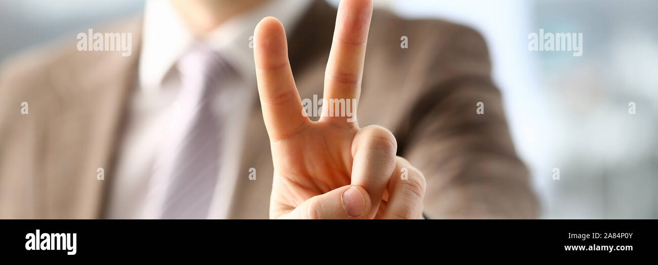 bright picture of handsome business man showing victory sign Stock ...