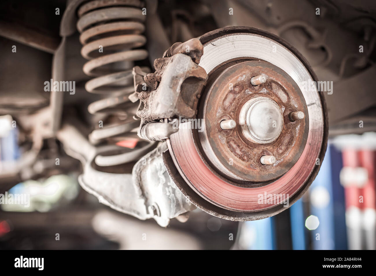 Motor vehicle on lift in auto vulcanizing and service workshop. Close ...
