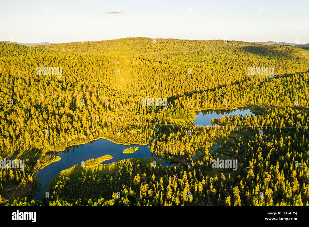 Warm evening sun lighting a typical Finnish countryside Stock Photo - Alamy