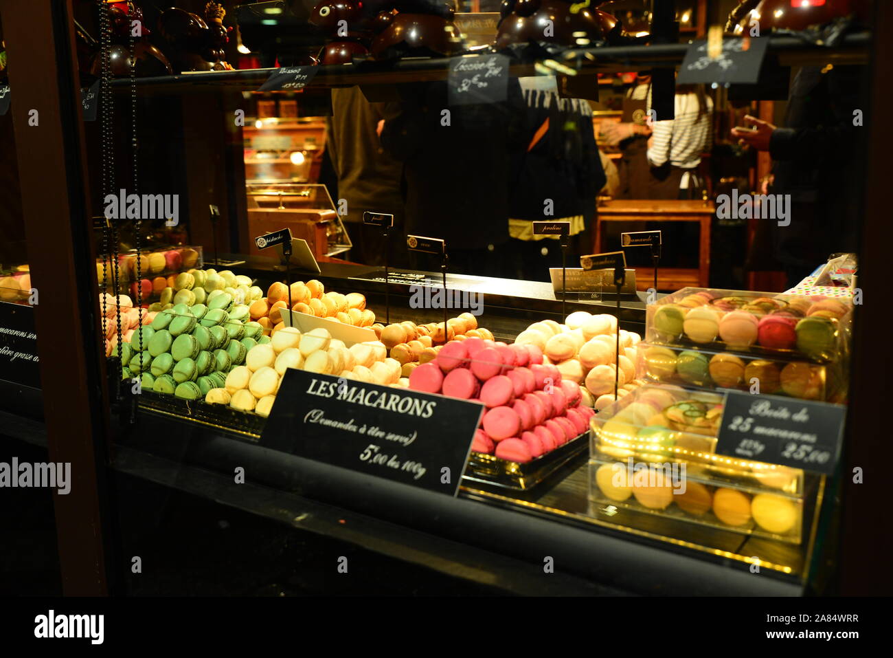 Colourful macarons on display in the window in Paris Stock Photo - Alamy