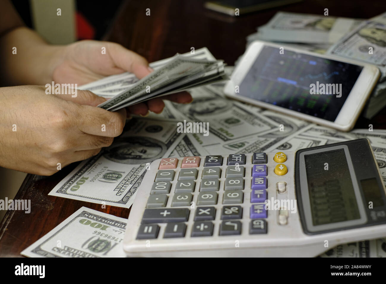 Women lots of money hi-res stock photography and images - Alamy