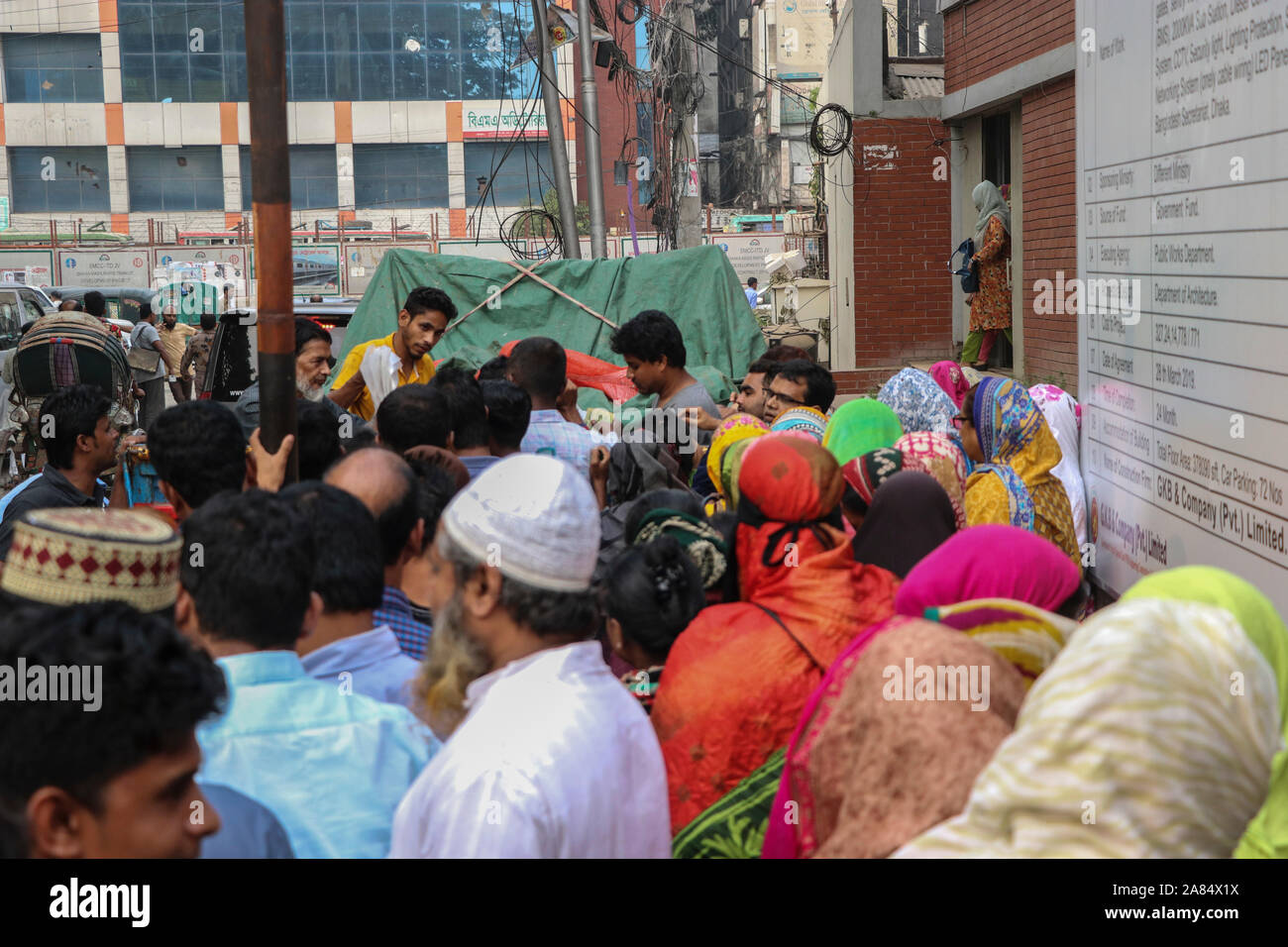 Dhaka, Bangladesh - November 06, 2019: People jostling to buy onions at ...