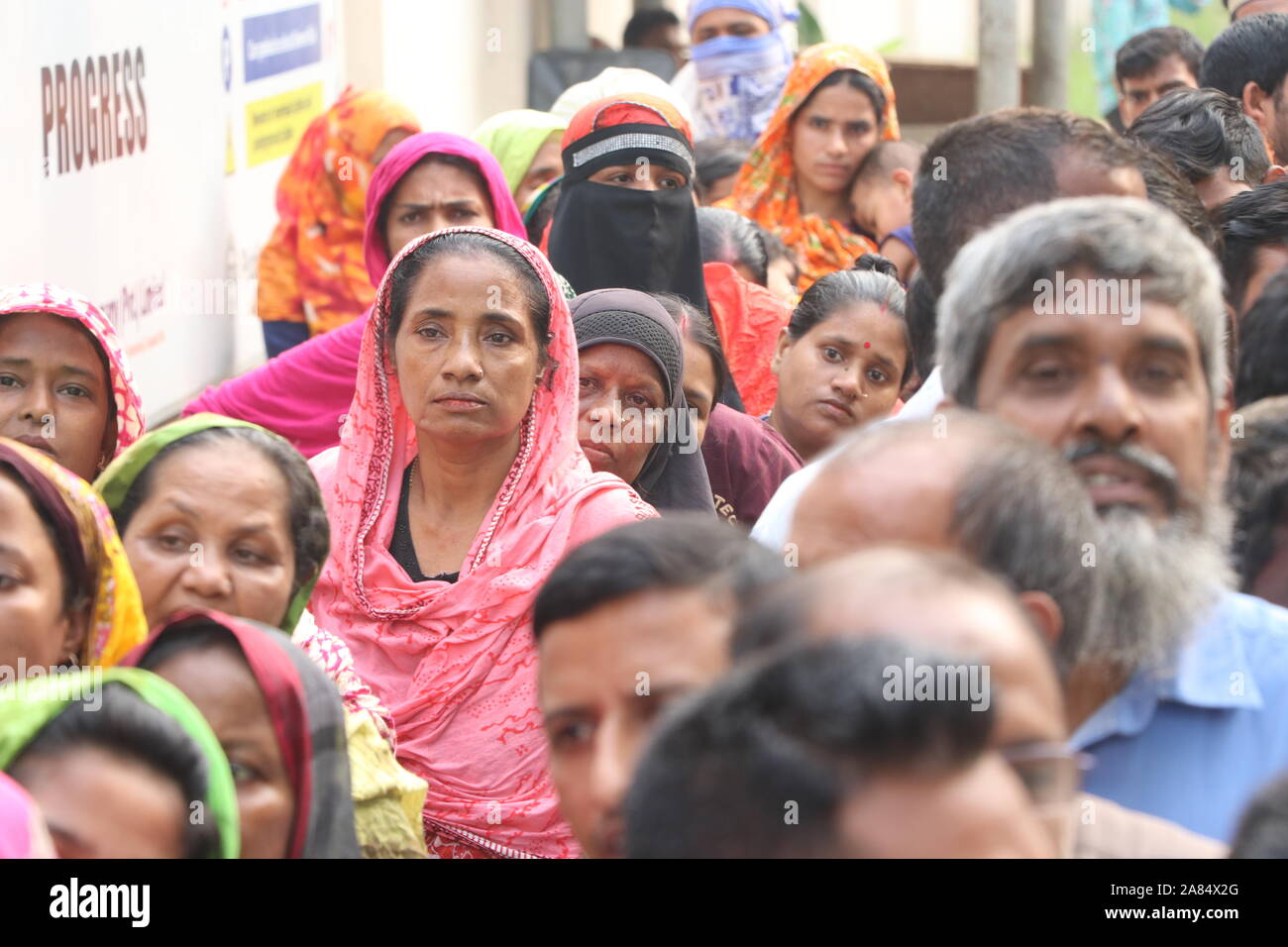 Dhaka, Bangladesh - November 06, 2019: People jostling to buy onions at ...