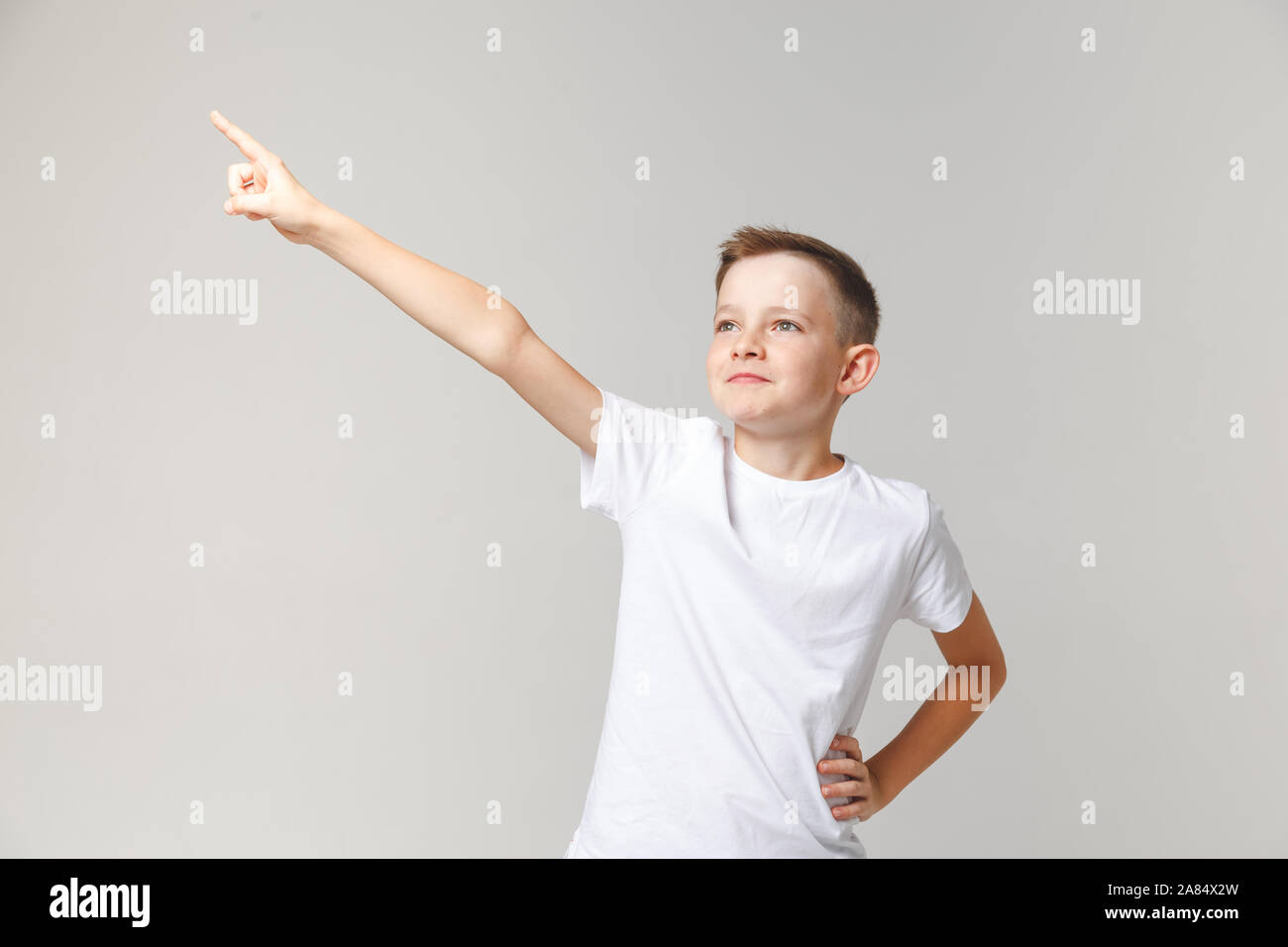 Boy raising a hand hi-res stock photography and images - Alamy