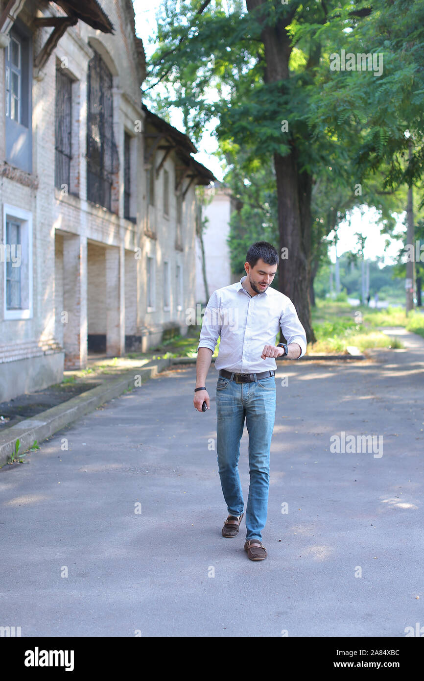 Happy confident man walking along hi-res stock photography and images ...