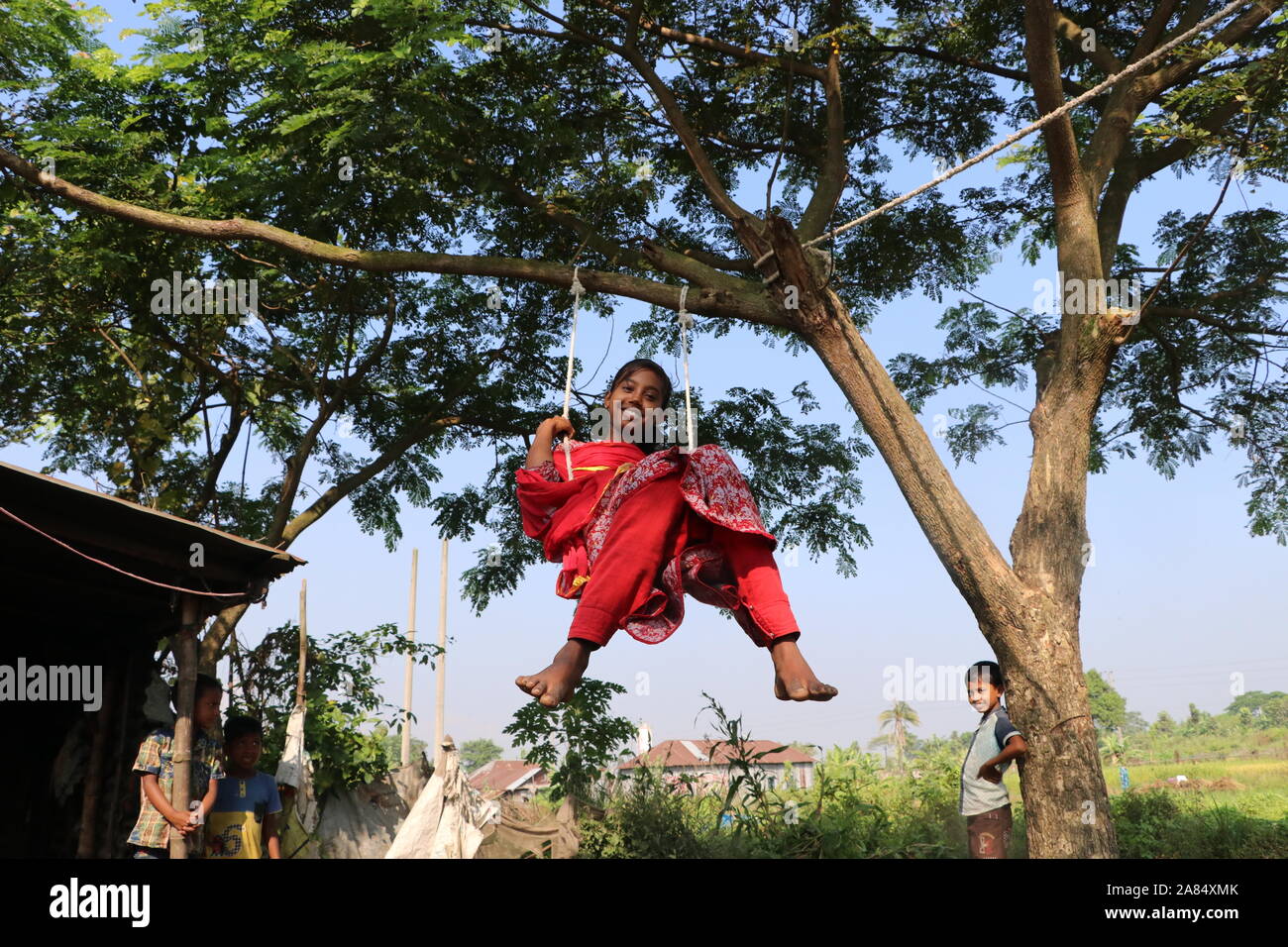 Bangladesh children playing 1nov2019,A child is swinging in his mind to ...